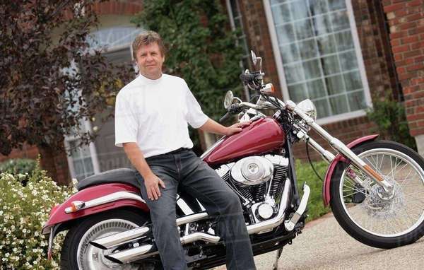 Portrait Of A Man With His Motorcycle - Royalty-free Stock Photo | Dissolve