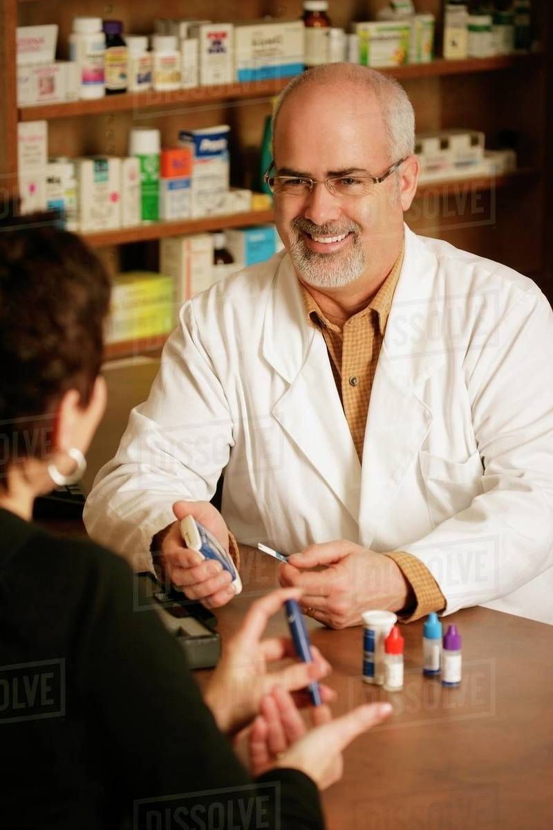 Pharmacist With Patient - Royalty-free Stock Photo | Dissolve