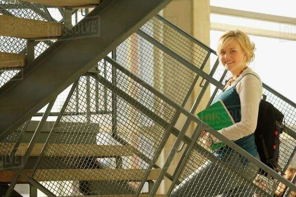 Student Going Up The Stairs - Royalty-free Stock Photo | Dissolve