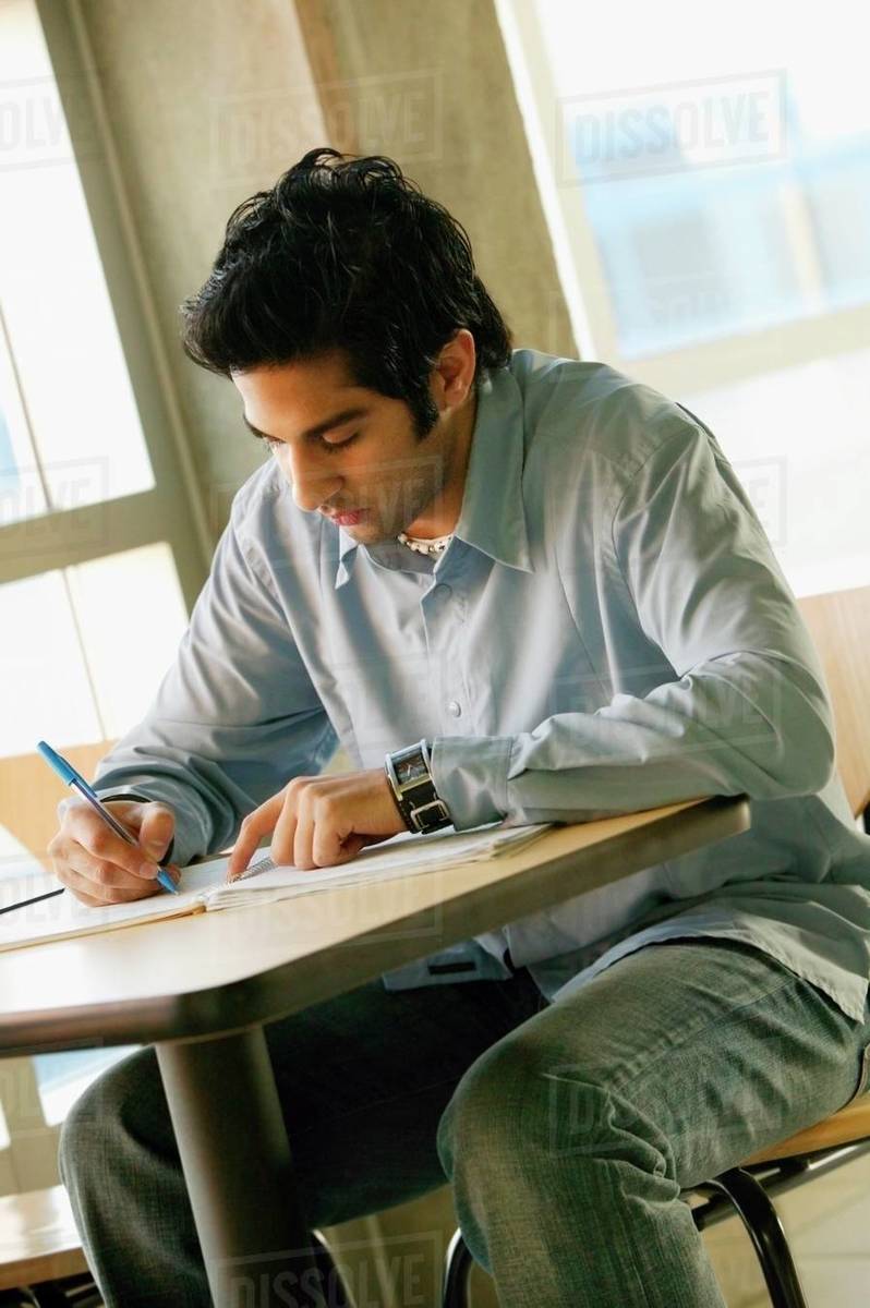 Male Student Studying - Stock Photo - Dissolve