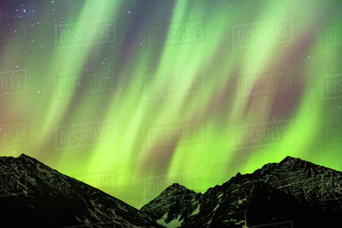 Northern Lights in the sky above Moose Pass, with silhouetted Kenai ...