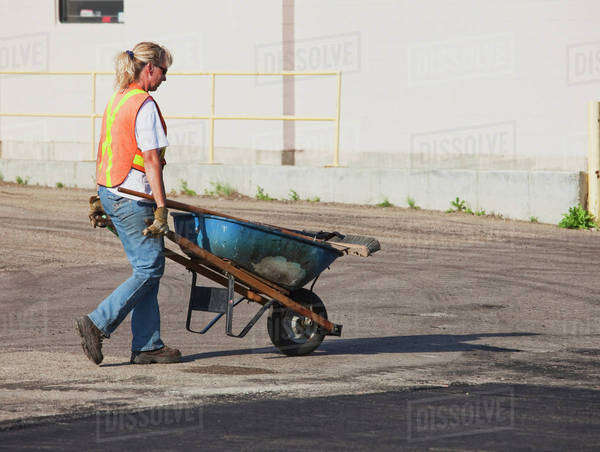 Woman at work on a paving crew; Edmonton, Alberta, Canada - Royalty ...