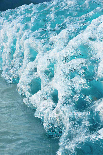 Close up of ice surface of iceberg broken off Mendenhall Glacier ...