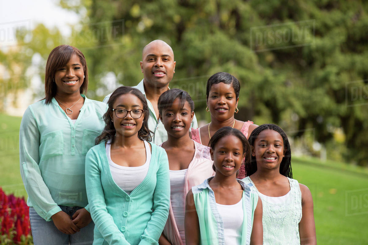 Portrait of a family with five daughters in a park; Edmonton, Alberta ...