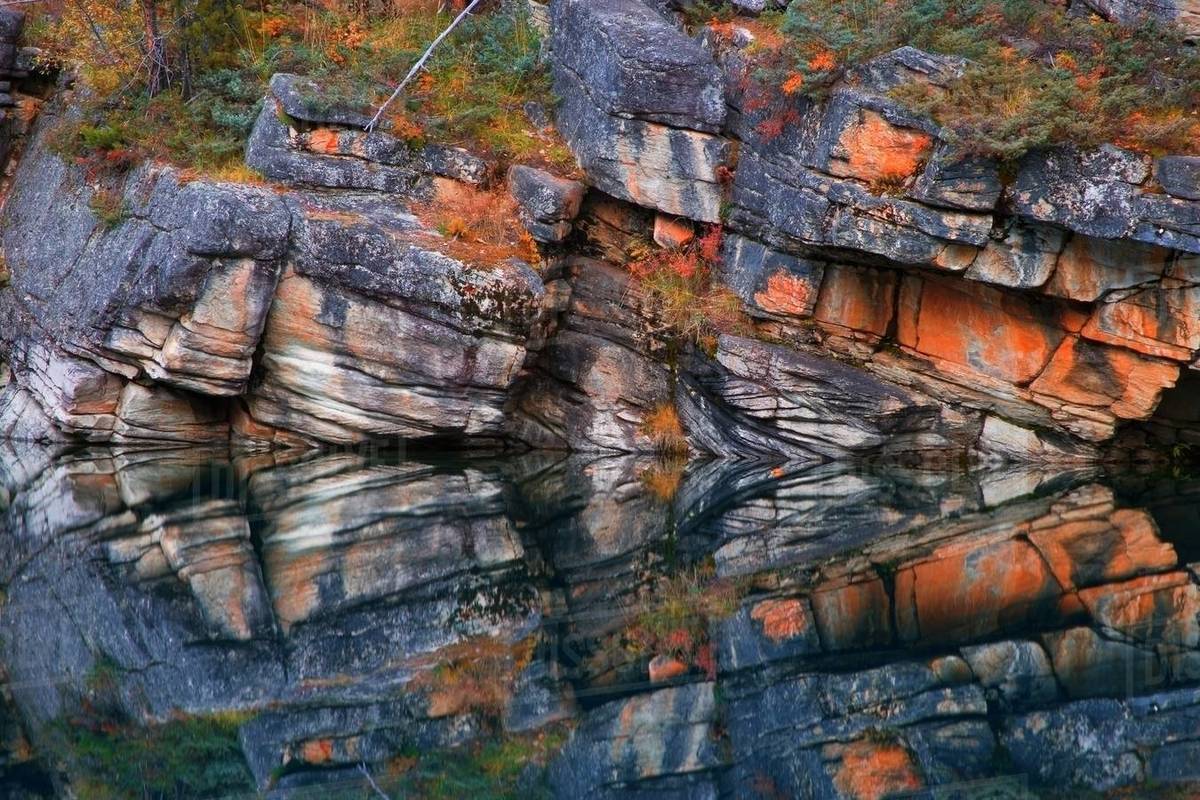 Reflection Of Rock In Water - Stock Photo - Dissolve