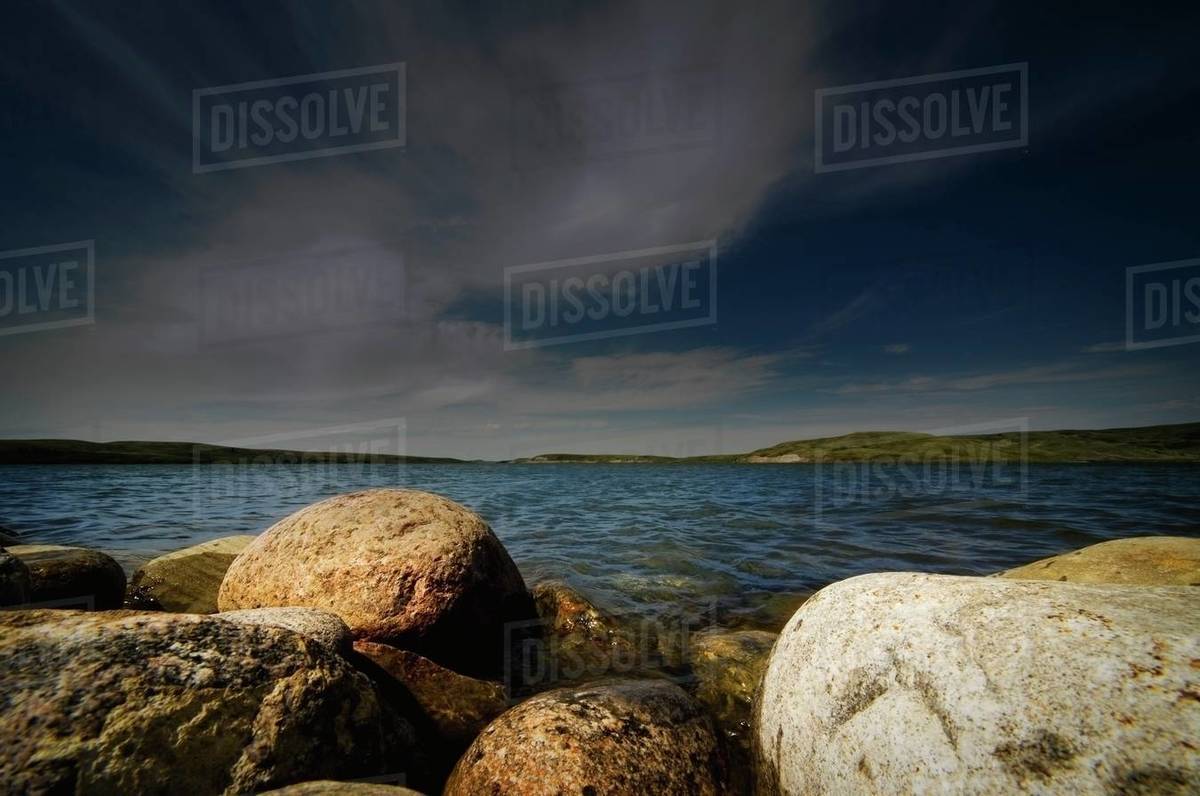 Rocks At Edge Of Lake - Royalty-free Stock Photo | Dissolve
