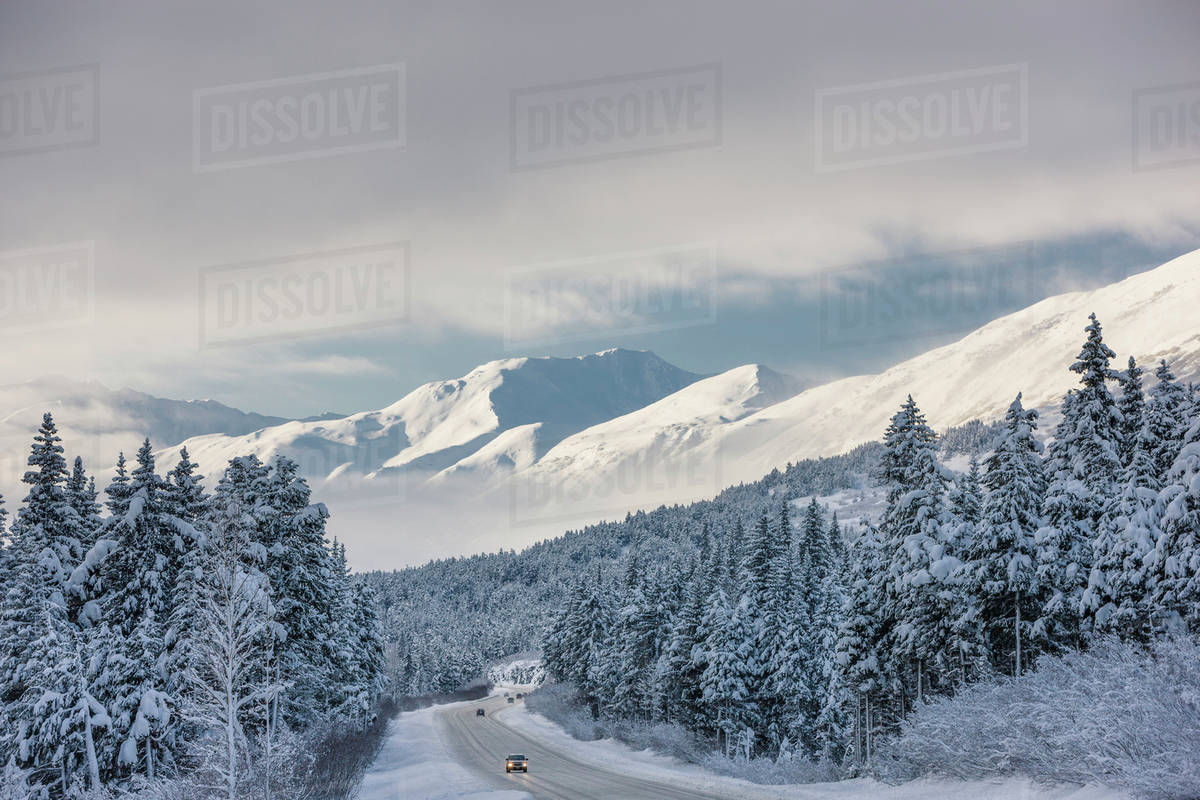Clouds clearing over Seward Highway from the Kenai Mountains above ...