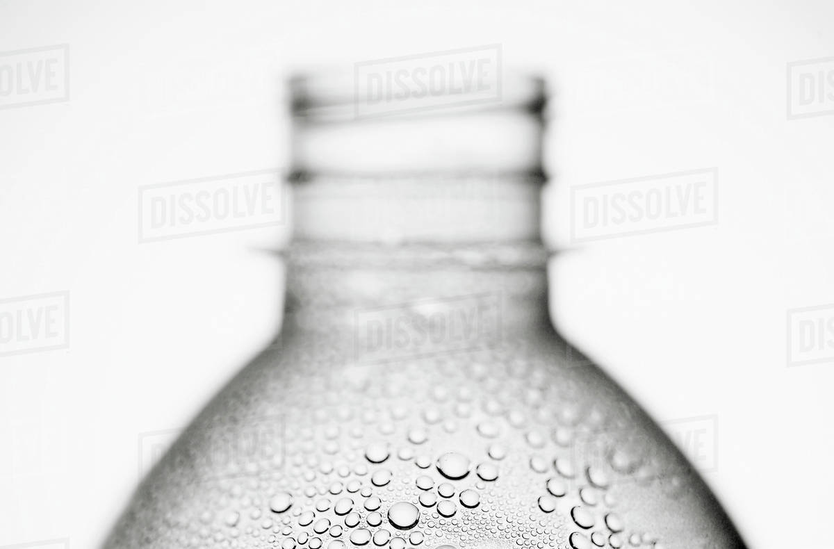 Water condensation on a plastic bottle - Stock Photo - Dissolve