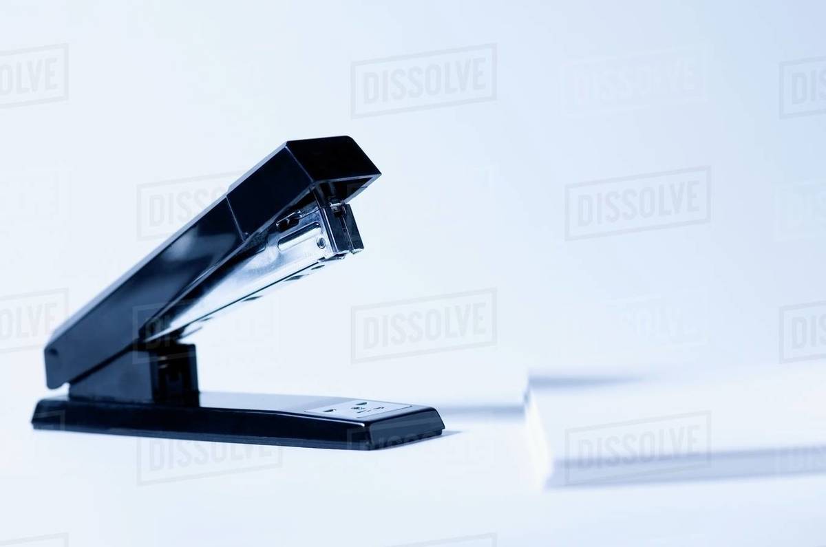 Stapler And Paper - Stock Photo - Dissolve