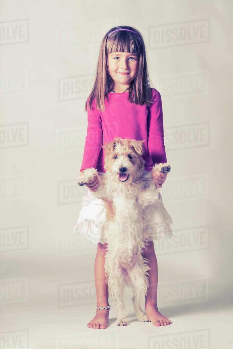 Portrait Of A Young Girl With Her Dog Standing On It's Hind Legs;Malaga ...