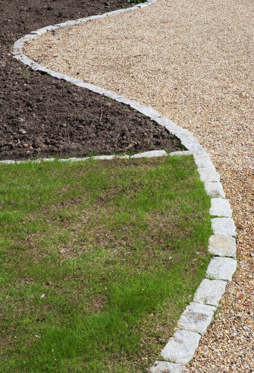 Garden floor divided with three different elements, grass, soil and ...