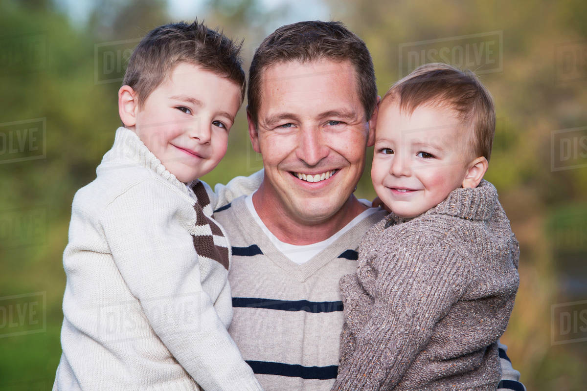 Portrait of a father and two young sons;St. albert alberta canada ...