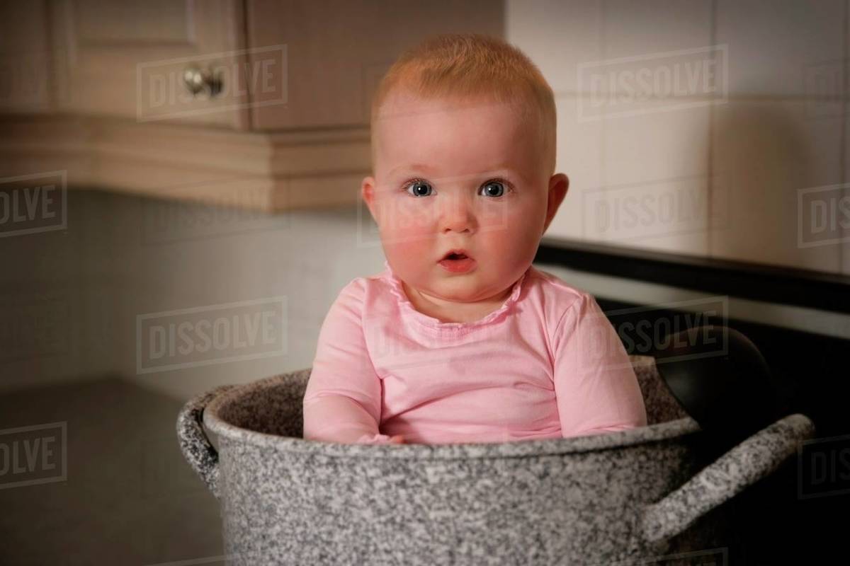 Baby In A Large Pot - Royalty-free Stock Photo | Dissolve