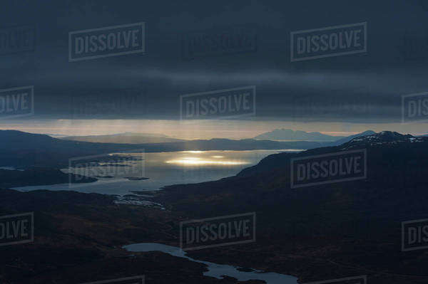 Crepuscular rays (beams of sunlight) coming through clouds as seen from ...