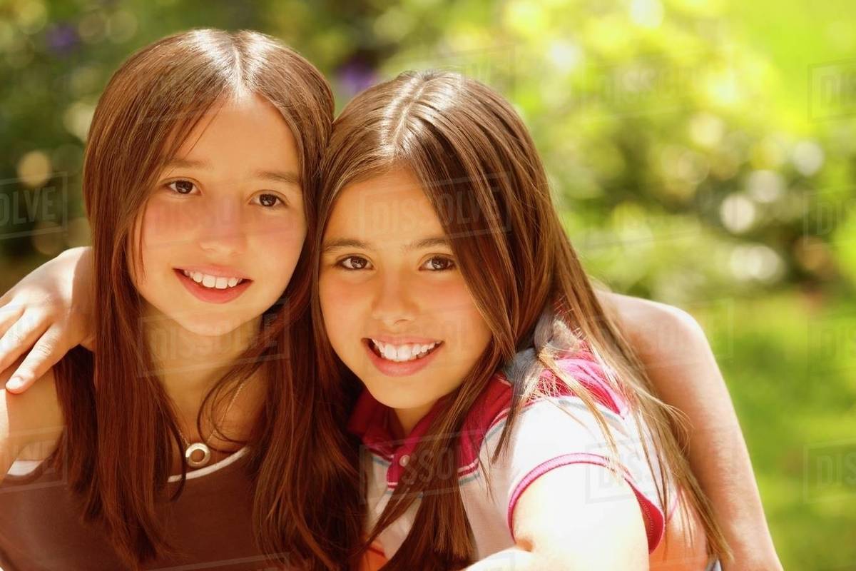 Two Smiling Sisters - Royalty-free Stock Photo | Dissolve