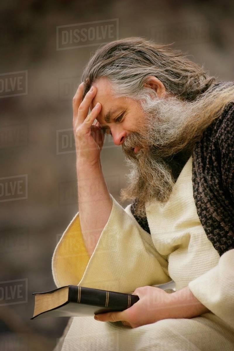Man Holding The Bible And Thinking - Royalty-free Stock Photo | Dissolve