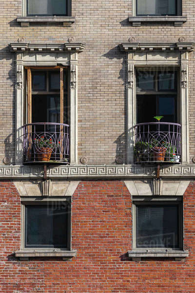 Decorative balconies on a residential building. The wrapped wrought ...