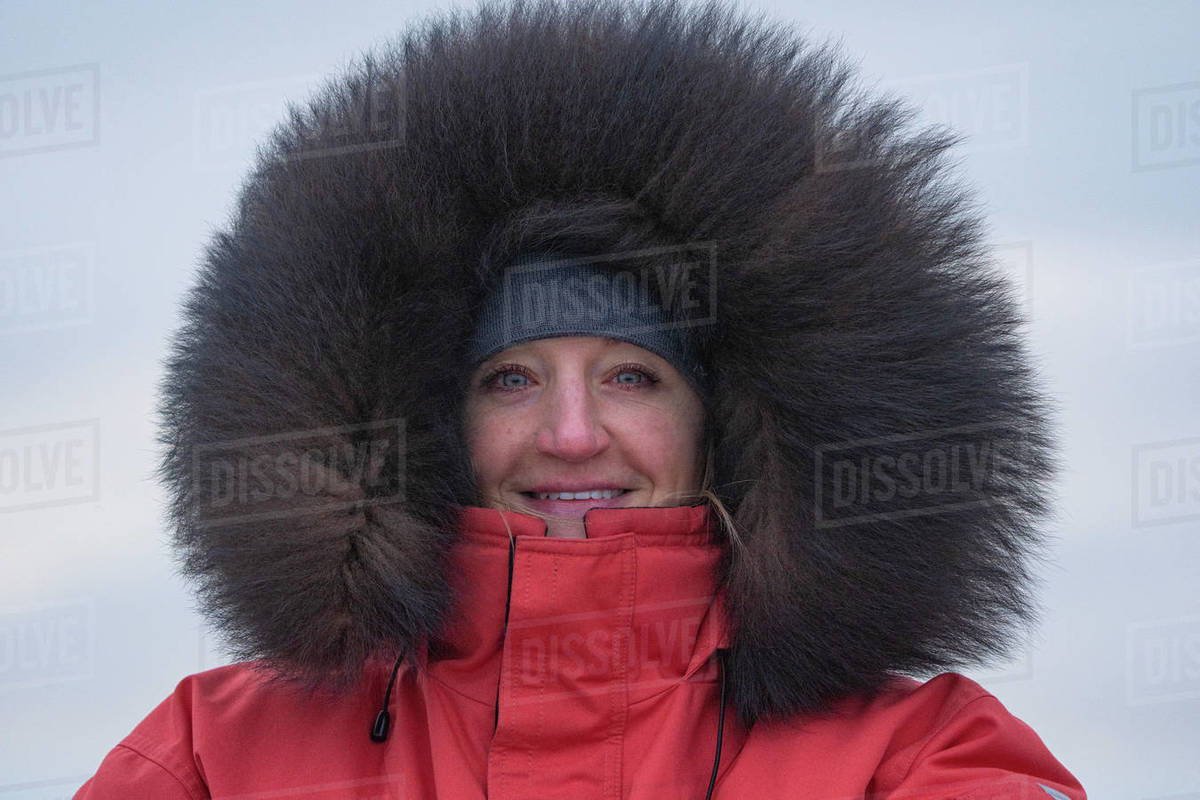 Woman dressed in a large winter parka in the extreme cold; Churchill ...