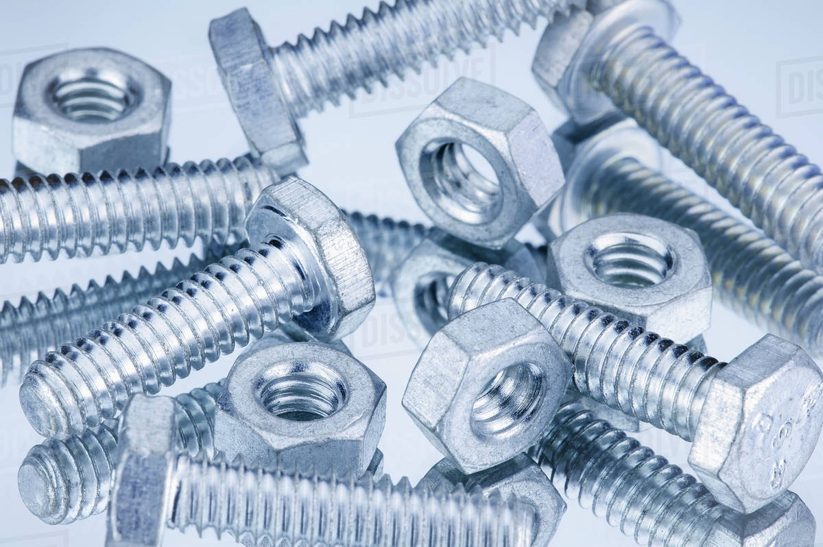 Silver screws and bolts on a white background - Stock Photo - Dissolve