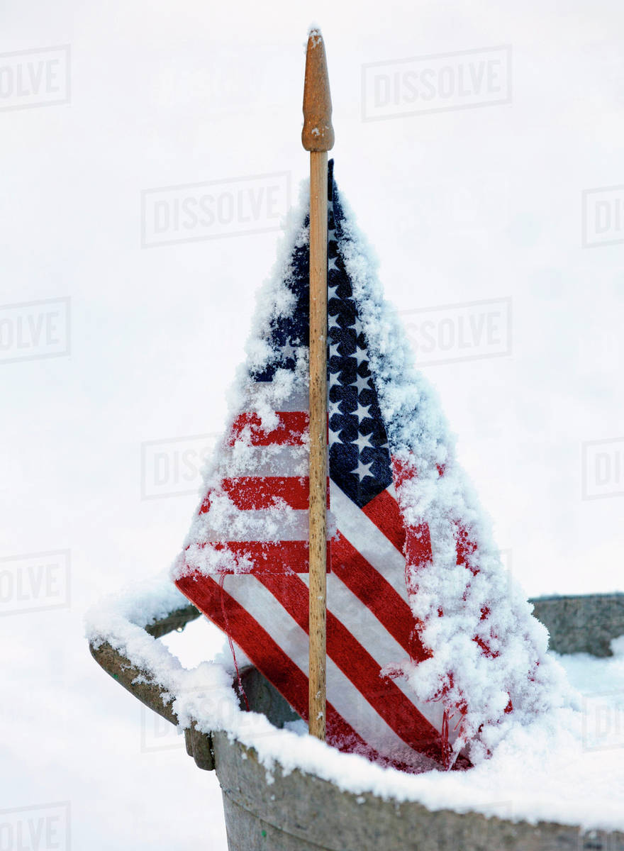 An American flag covered in snow;United States of America - Royalty ...