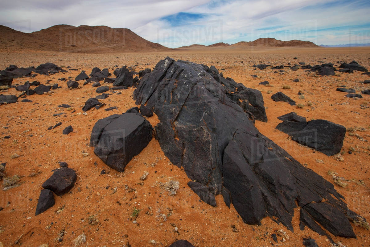 Pitch black rocks in the desert;Klein-aus vista namibia - Royalty-free ...