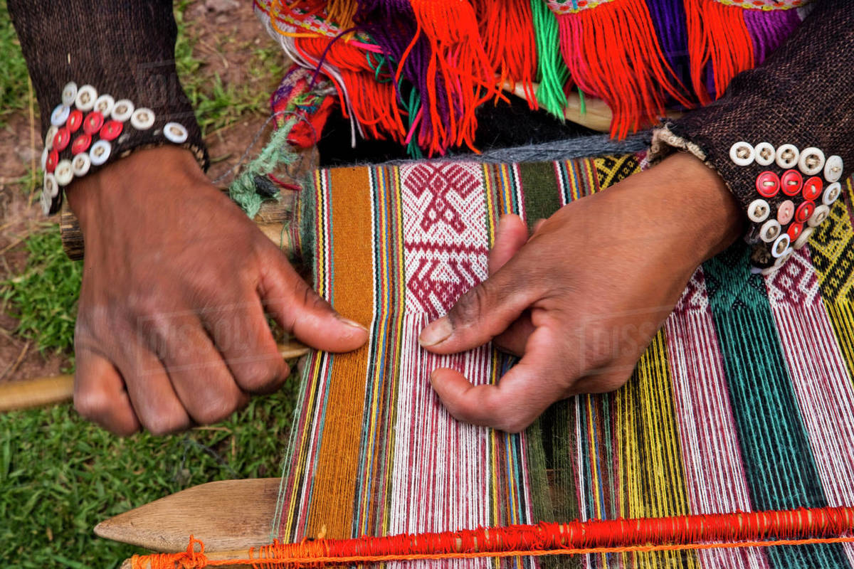Peruvian weaving using traditional methods; Sacred Valley, Peru ...