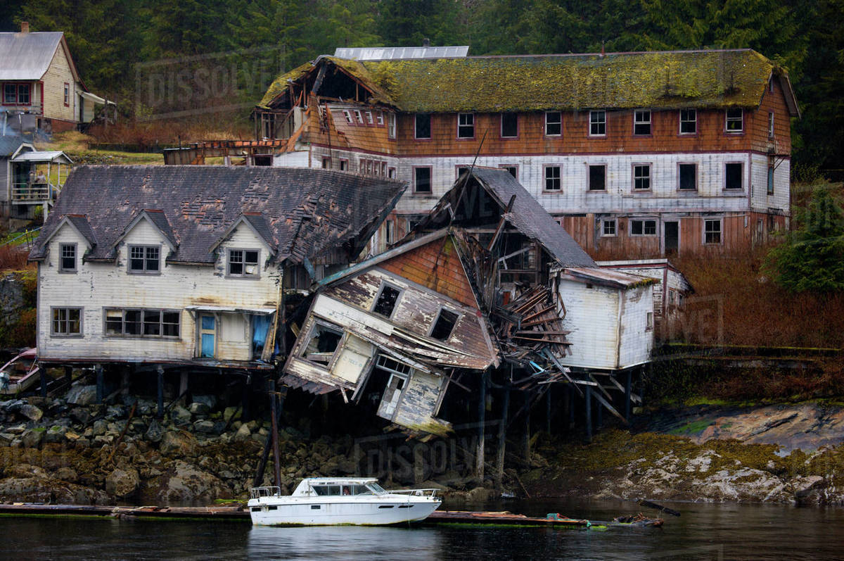 Old fishing cannery collapsing into the inlet; Khutze Inlet, British ...