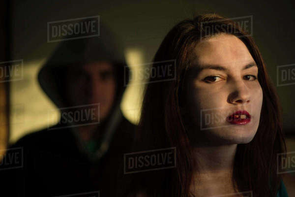 Man stands behind a vampire-like woman with blood in her mouth; Lincoln ...