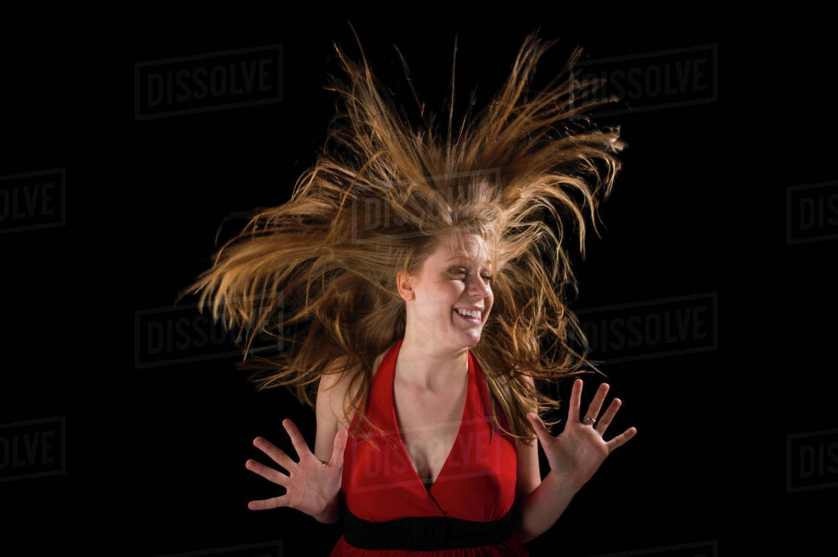 Young woman's hair flies dramatically up around her head; Lincoln ...