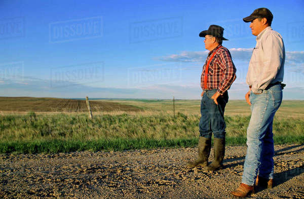 Father and son together on their ranch; Howes, South Dakota, United ...