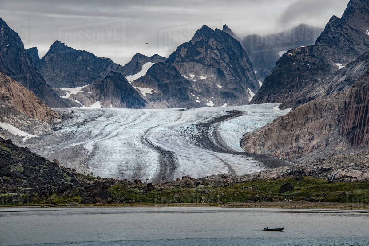 View of glacier flowing through the mountain peaks at the Southern tip ...