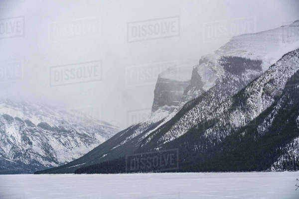 Cold winter conditions over Lake Minnewanka in the Rocky Mountains ...