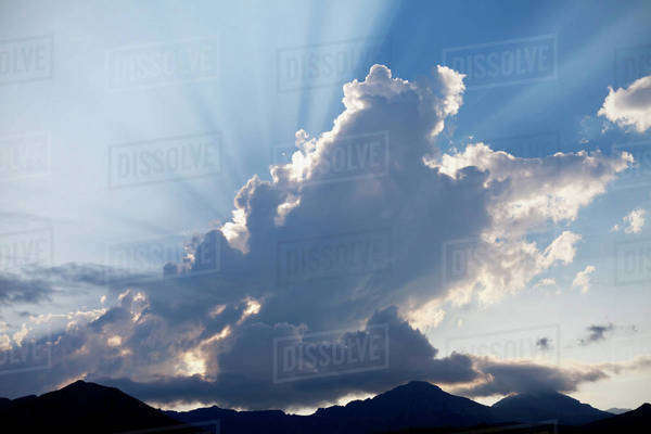 The Hidden Sun Escapes In Ray Among The Clouds Above Waterton Lakes ...