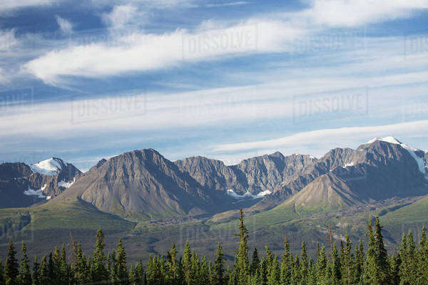 Rugged mountain range and forest; Haines Junction, Yukon, Canada ...