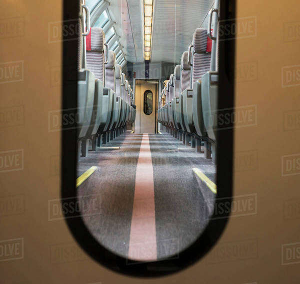 View of seating in a train through the window in a door; Locarno ...
