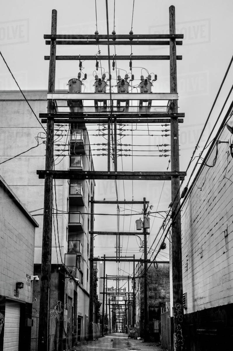 Poles, transformers and wires form a structure for electrical power ...
