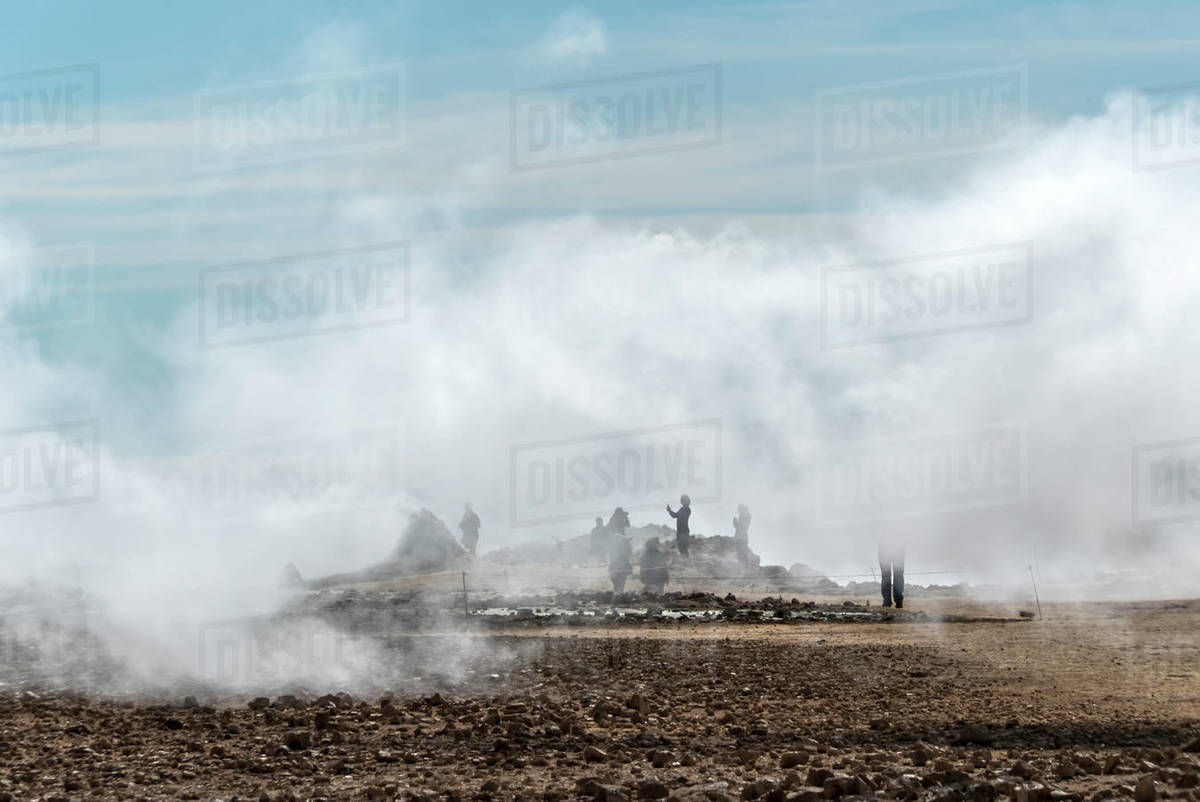 People standing at the overlook and taking pictures of Lake Myvatn ...