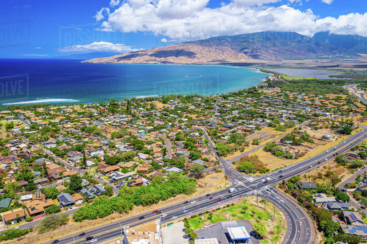 Aerial view of the town and main thoroughfare along the oceanfront of ...
