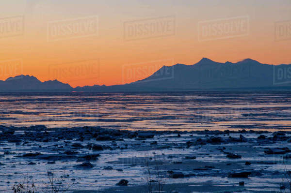 Winter sunset seen from downtown Anchorage, looking across the inlet at ...
