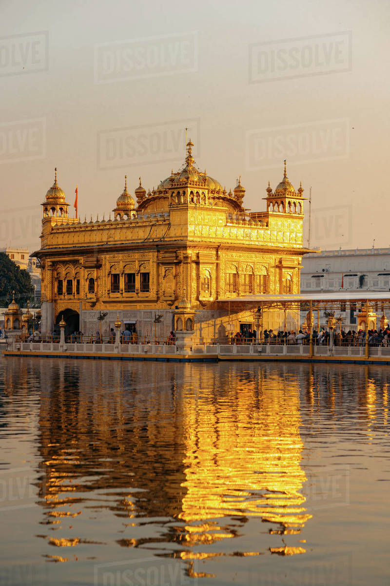Golden Temple, a Sikh Gurdwara with the mirror image reflection in a ...