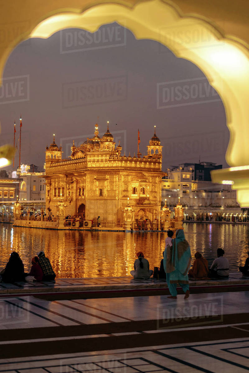 Golden Temple, a Sikh Gurdwara with pool of water and framed by a ...