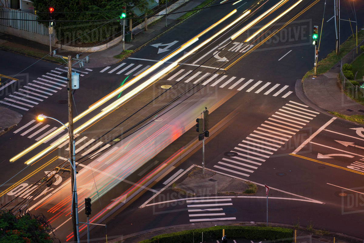 High angle view of an intersection with painted arrows and crosswalks ...