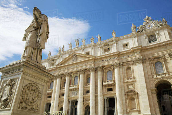 St. Peter's Basilica and statue of Pope Pius IX in St. Peter's Square ...