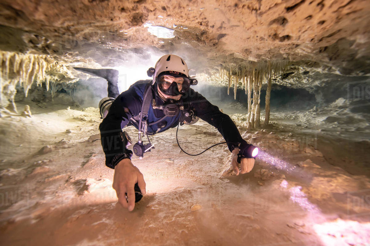 A cave diver in a remote section of cave. - Royalty-free Stock Photo ...