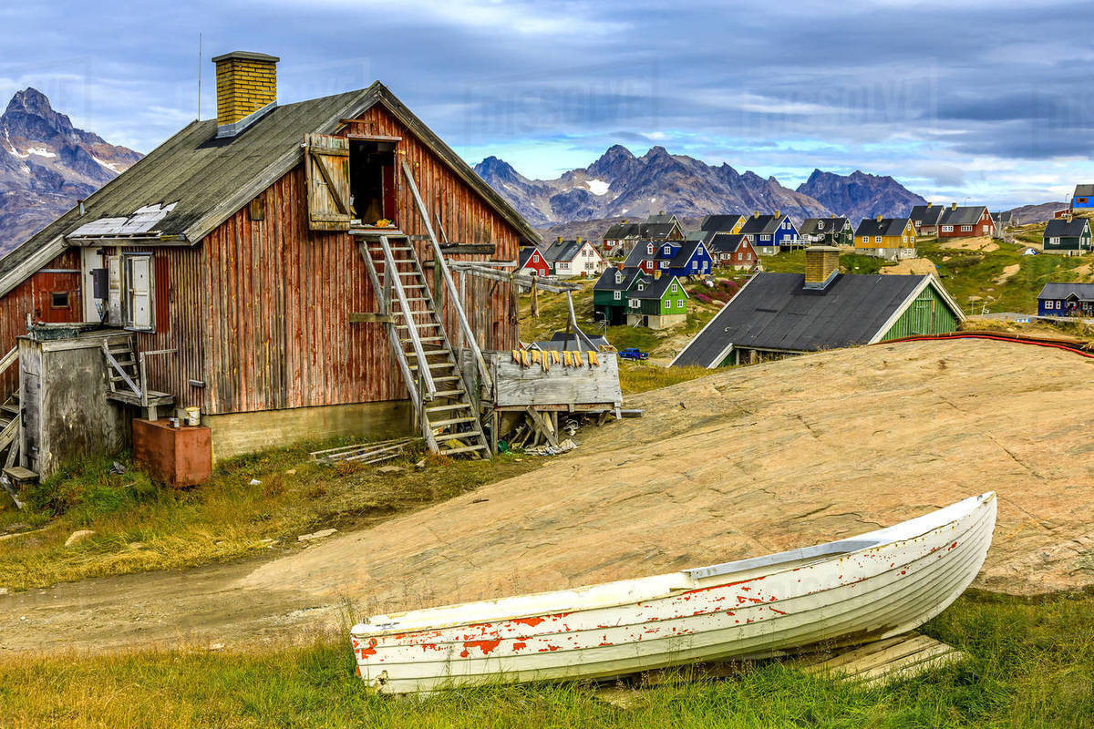 Old boat and building in the Inuit Village of Tasiilaq. - Royalty-free ...