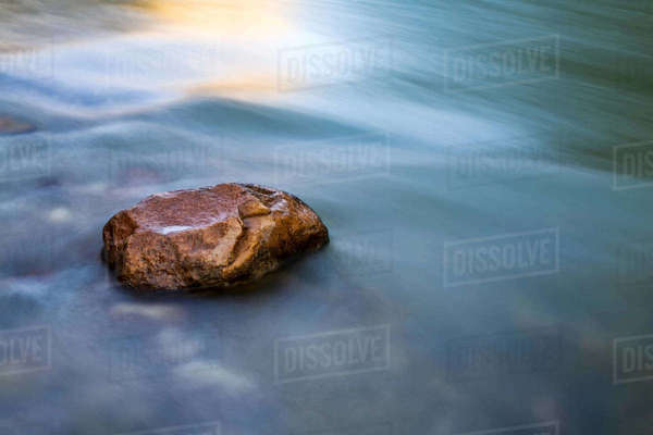 Boulder and flowing water, Colorado River, Grand Canyon, Arizona ...