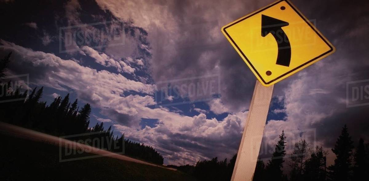 Road Sign Pointing Left - Stock Photo - Dissolve
