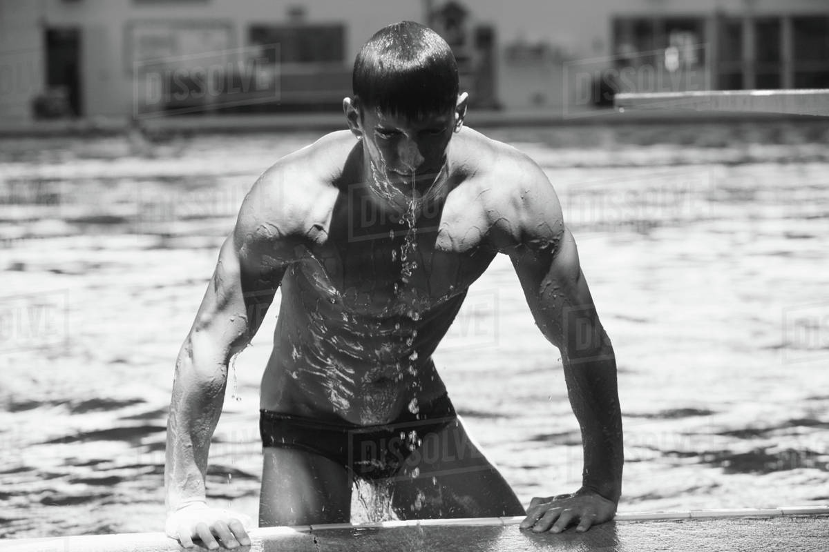 Diver Pulling Himself Out Of The Pool With Water Dripping Off Him ...