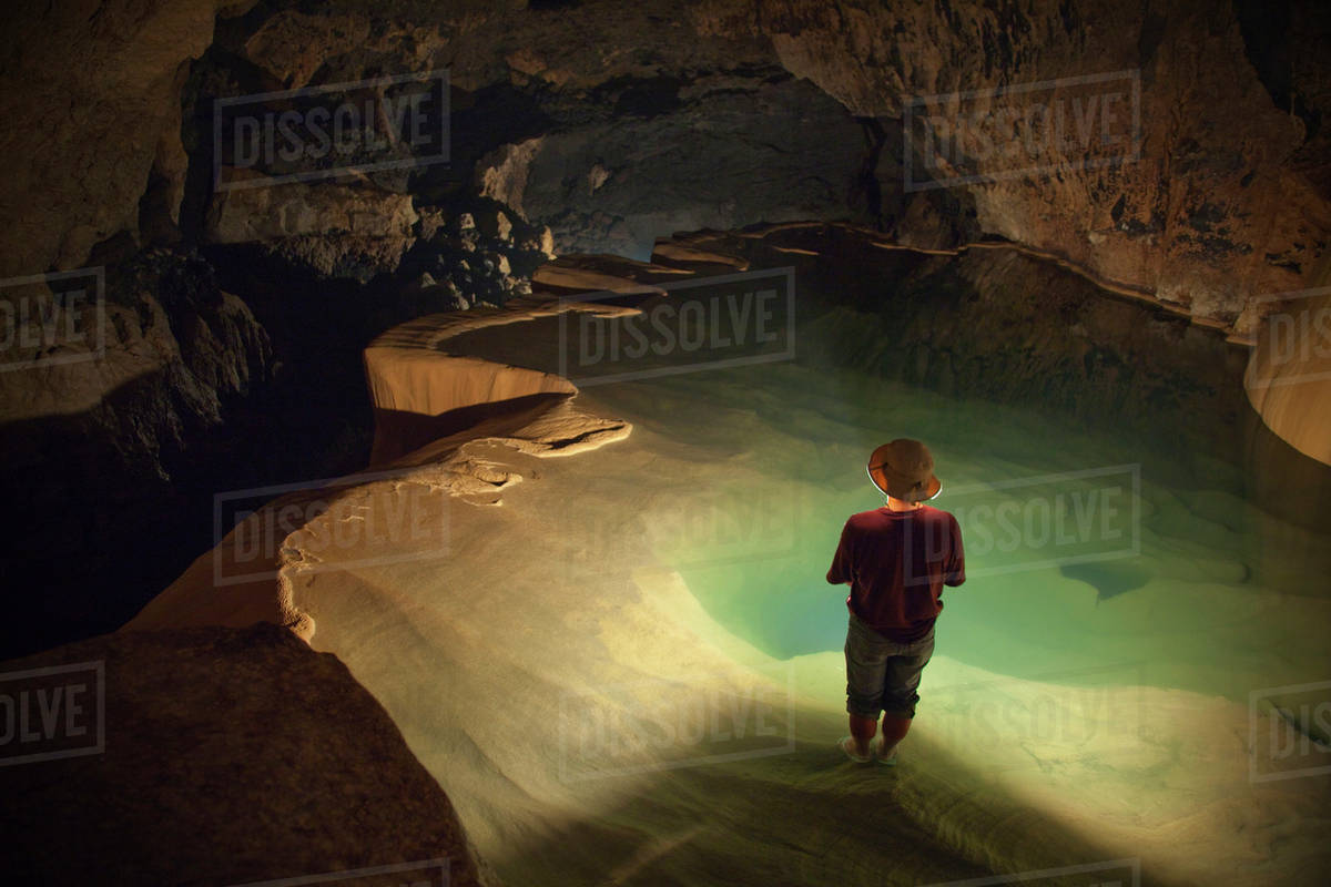 A Filipino Tour Guide Holds A Lantern Inside Sumaging Cave Or Big Cave ...