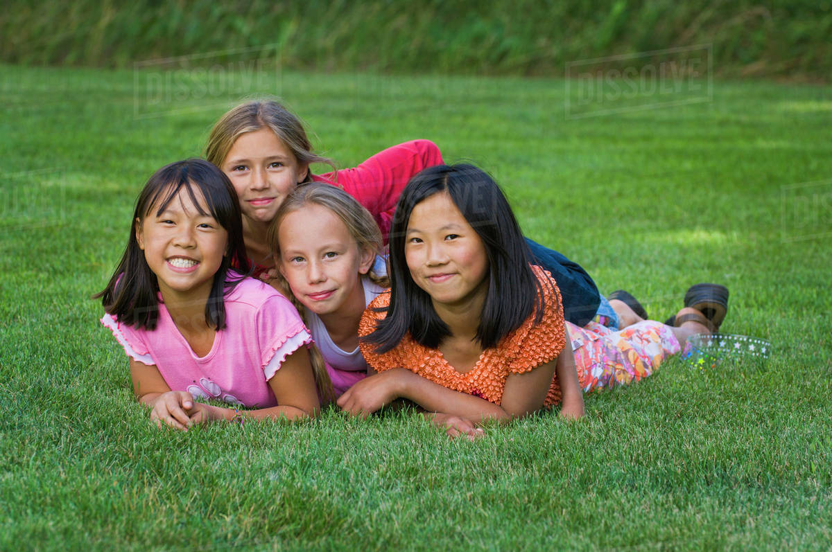 Group Of Girls On A Lawn; Edmonton, Alberta, Canada - Royalty-free ...
